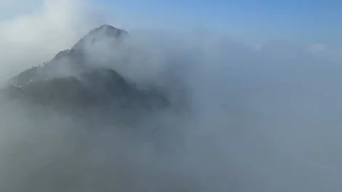 Misty Mount Huangshan with a blue sky ba... | Stock Video | Pond5