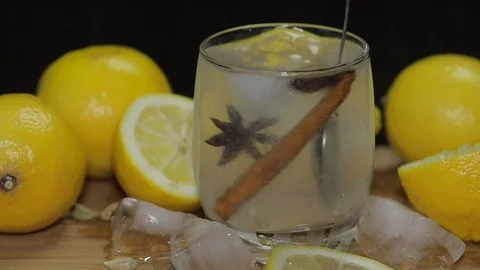 Mix with a spoon lemon cocktail. Refresh... | Stock Video | Pond5
