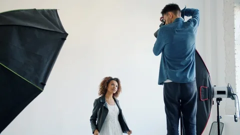 Mixed race model posing in studio while ... | Stock Video | Pond5