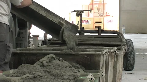Mixer truck filling a concrete bucket in... | Stock Video | Pond5