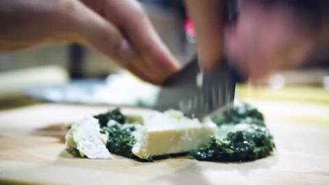 Mixing and spinning cheese with spinach ... | Stock Video | Pond5