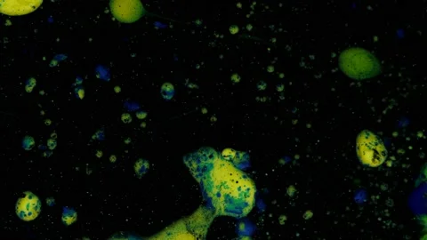 Mixing of blue, yellow and green colors ... | Stock Video | Pond5