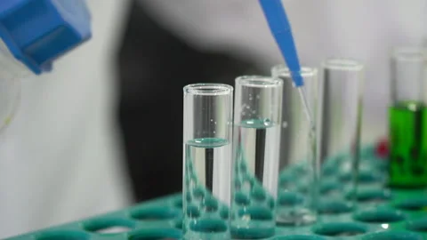 mixing chemicals in laboratory, testing ... | Stock Video | Pond5