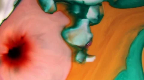 Mixing colorful fluids in water creating... | Stock Video | Pond5