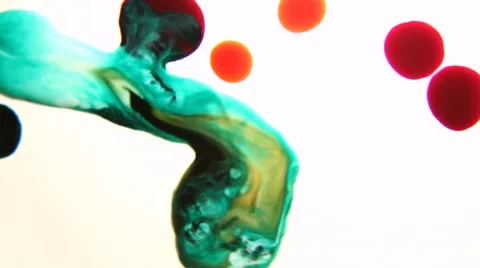 Mixing colorful fluids in water creating... | Stock Video | Pond5