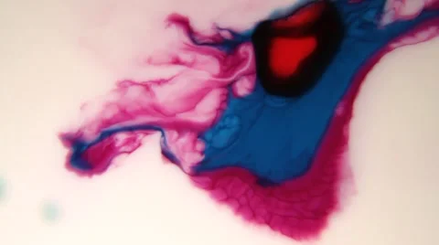 Mixing colorful fluids in water creating... | Stock Video | Pond5