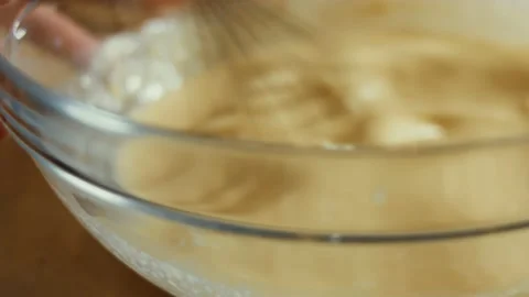 Mixing fresh eggs with steel hand mixer ... | Stock Video | Pond5