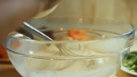 Mixing fresh eggs with steel hand mixer ... | Stock Video | Pond5