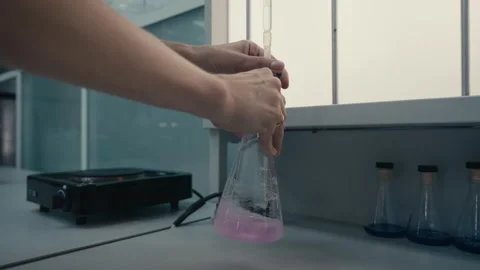 Mixing the liquid inside the small glass... | Stock Video | Pond5