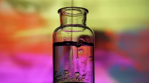 Mixing two liquid substances in chemistr... | Stock Video | Pond5