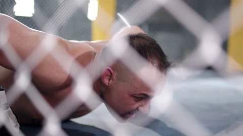 MMA fighter is falling on the floor afte... | Stock Video | Pond5