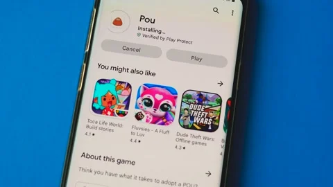 Mobile game Pou is installed on a smartp... | Stock Video | Pond5