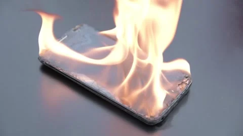 Mobile phone explodes and burns. Cell Ph... | Stock Video | Pond5