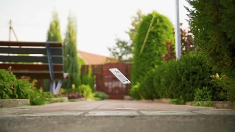 Mobile phone falls and breaks on the con... | Stock Video | Pond5