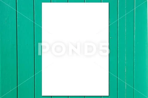 Mock up white empty blank sheet on green plank wooden table in mockup ...