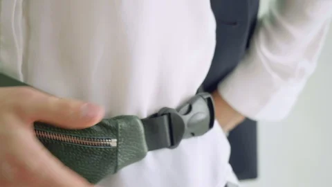 Model with black fanny pack on hips pose... | Stock Video | Pond5