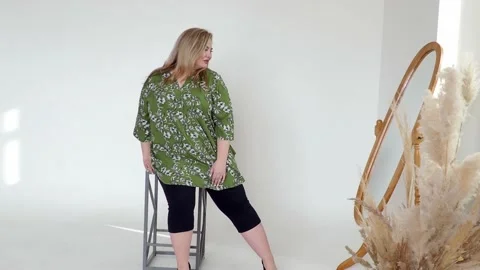 model of an overweight girl on a white b... | Stock Video | Pond5