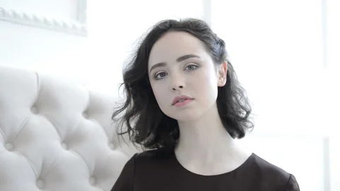 model poses at a photoshoot in studio | Stock Video | Pond5