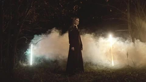 Model posing with fog machine in forest ... | Stock Video | Pond5