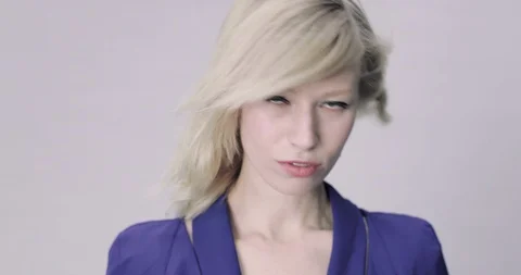 Model posing on a photoshoot with wind m... | Stock Video | Pond5