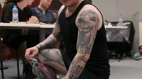 A model shows his tattoos audience and j... | Stock Video | Pond5