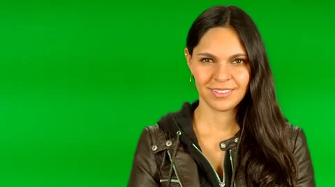 Model smiling, holding up phone with gre... | Stock Video | Pond5