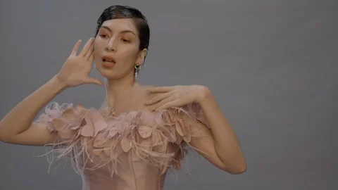 Model striking poses for camera, Isolate... | Stock Video | Pond5