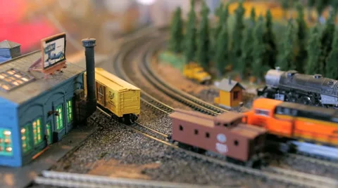 A model toy train rounds a corner with t... | Stock Video | Pond5