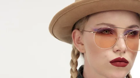 models in hat with two braids and glasse... | Stock Video | Pond5