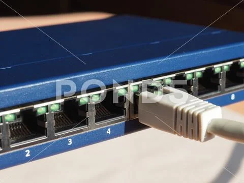 Photograph: Modem router switch with RJ45 ethernet plug ports #86019782