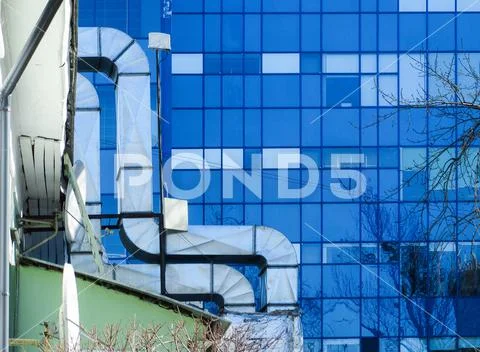 Modern architecture, pipes and structural elements on the background of ...