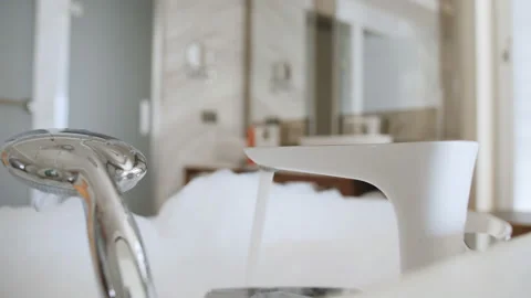 A modern bathroom with a large bath in w... | Stock Video | Pond5