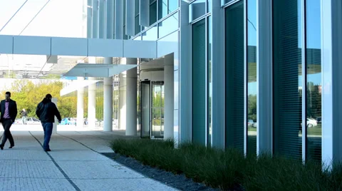 modern building and people entering into... | Stock Video | Pond5