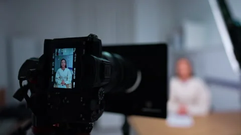 Modern camera shooting a woman giving a ... | Stock Video | Pond5