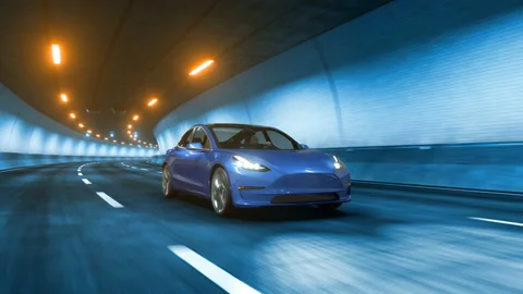 Modern Electric car rides trough tunnel ... | Stock Video | Pond5
