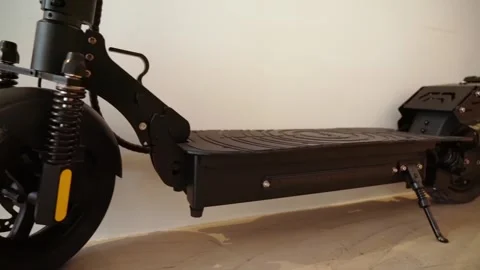 A modern electric scooter with spring-mo... | Stock Video | Pond5