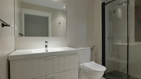 Modern empty bathroom with gray tiles, t... | Stock Video | Pond5