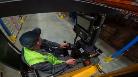 Modern forklift works in a warehouse. Th... | Stock Video | Pond5