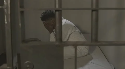 Modern Jail Scene - Man crying in cell -... | Stock Video | Pond5