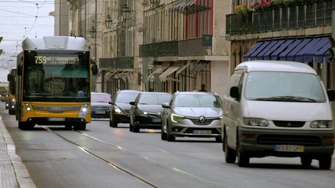 Modern local buses driving along main st... | Stock Video | Pond5