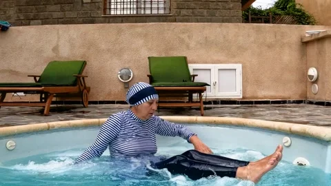 modern Muslim woman in a swimming pool | Stock Video | Pond5