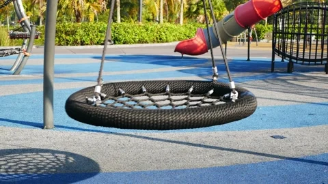 Modern new round net swing in a playgrou... | Stock Video | Pond5