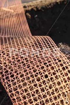 Modern orange safety fence (polymeric mesh grid) closeup ~ Hi Res ...