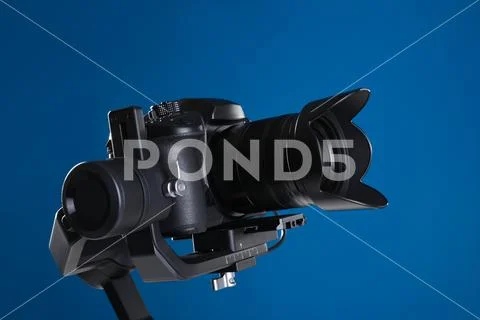 Modern professional video camera on blue background ~ Premium Photo ...