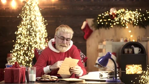 Modern Santa Claus reading wish list let... | Stock Video | Pond5