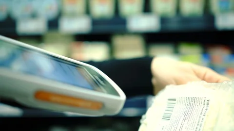 Modern shopping in the supermarket. Scan... | Stock Video | Pond5