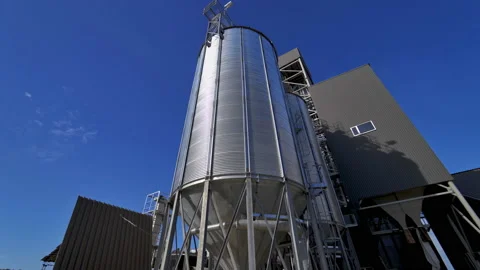 Modern silos on blue sky background. Lar... | Stock Video | Pond5