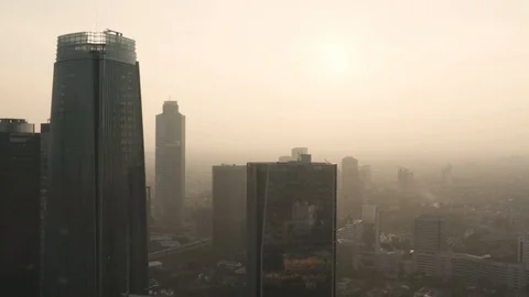 Modern skyscrapers with air pollution at... | Stock Video | Pond5