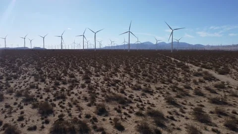 Mojave Wind Farm low fly past turbines c... | Stock Video | Pond5