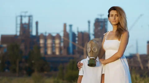 Mom and son in a gas mask stand in the b... | Stock Video | Pond5